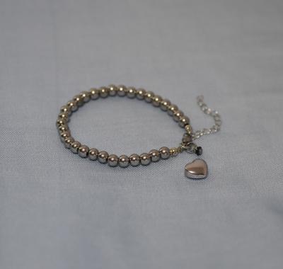 Cina OEM/ODM Polsetta di profumo a forma di cuore liscia Memoriale Braccialetto da donna in acciaio inossidabile in vendita