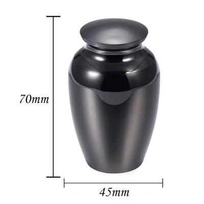 Cina Boccone di cremazione 70x45mm con disegno di zampa di cane inciso realizzato in lega di alluminio resistente in vendita