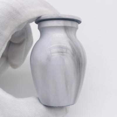 Cina OEM/ODM Urna di cremazione di granelli di marmo per ceneri umani e animali domestici 68*44mm 8 anni di esperienza in vendita