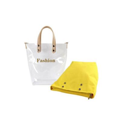 中国 キャンバスの挿入物袋が付いている買物をする透明なポリ塩化ビニールCrossbodyのトート バック30*35*15cm 販売のため