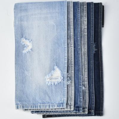 China 11.9oz Shrink Resistant Cotton Polyester Spandex Blue Stretch Denim Fabric for sale