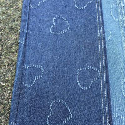 China Embroidered Style Stretch Heart Shape Pattern Blue Denim Fabric For Women Jeans 10.6 Oz JSD3077 10*7OE Yarn Count for sale