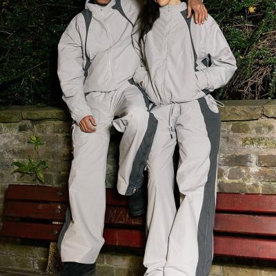 China Lightweight Windbreaker Sweat Suits Splicing Loose Sportswear Unisex Discharge Printing for sale