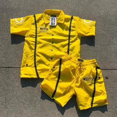 China Custom Windbreaker Knoppen Polyester Nylon Polo Shirt 2 Piece Set Shorts Jogging Suit Mensen T-shirts Kort Set Tracksuit voor mannen Te koop