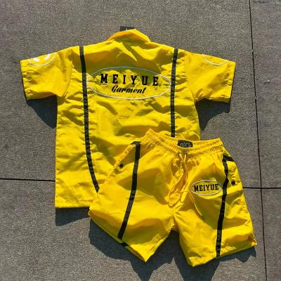 China Custom Windbreaker Buttons Polyester Nylon Polo Shirt 2 Piece Set Shorts Jogging Suit Men T Shirts Short Set Tracksuit for Men for sale