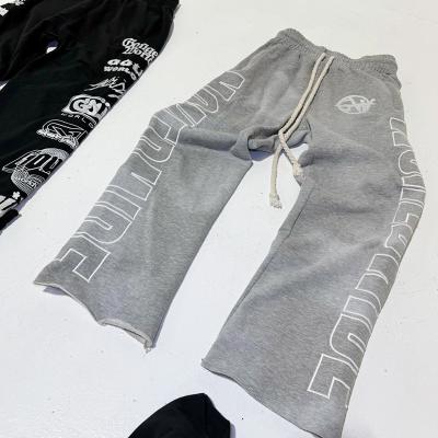 China OEM Custom Print Logo Raw Hem 100 Cotton Heavyweight Stacked Flared Sweat Pants Track Pant Straight Legging Sweatpants Men for sale