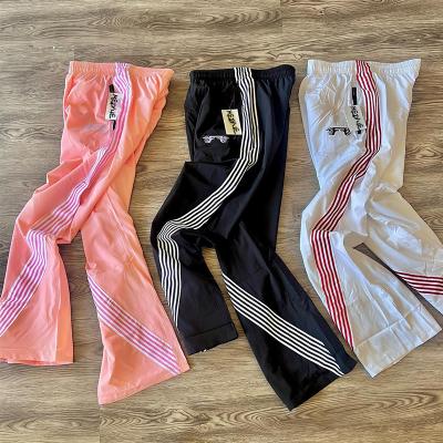 China Custom Logo Windbreaker Sweatpants Joggers Pants Nylon Stripe Trousers Wide Leg Sweat Pants Men's Loose Pants & Trousers for sale