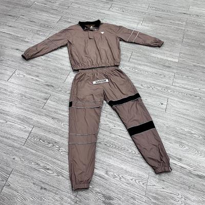 China Customized Printing Label Nylon Fabric Windbreaker Jacket Leggings Sweat Pants Tracksuit Joggers Sweatsuit OEM Clothing for sale