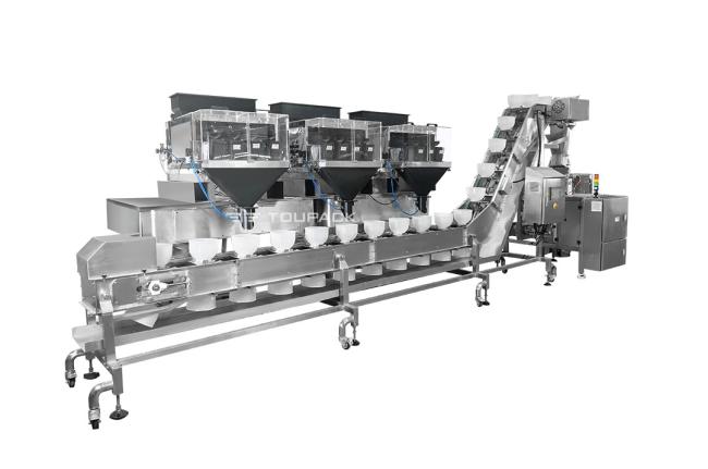 Multi-material Mixing weighing and packaging system in operation