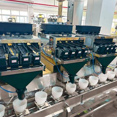 Cina Confezionatrice per mangime per pappagalli da 2,5 kg con pesatrice a teste multiple in vendita