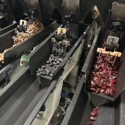 Cina Confezionatrice per mangime per pappagalli da 2,5 kg con pesatrice a teste multiple in vendita