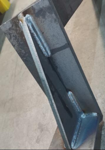 Close-up of robotic welding system components