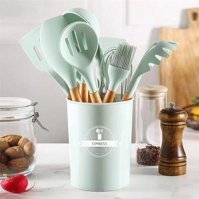 Cina L'utensile della cucina del silicone mette l'insieme di legno degli utensili degli aggeggi della cucina della maniglia in vendita