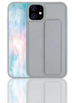 Cina 2 in 1 supporto materiale antiurto della presa del dito della cassa TPU del telefono di colore di Candy in vendita