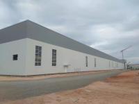China Multi Function Industrial Steel Warehouse Building Expandable Modular Bay 80m Span for sale