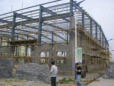 중국 AWS D1.1 용접 표준을 준수하는 내구성이 뛰어난 산업용 강철 건물, 100-275g/m2 아연 코팅 및 50년 이상 수명 판매용