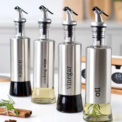 China Cheap Hot Sale Kitchen Glass Oil Pot Creative Stainless Steel Seasoning Bottle Leak Proof Soy Sauce Dispensers Bottle for sale