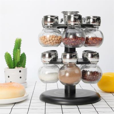 China Multipurpose 12Pcs Revolving Glass Spice Jar Rack Storage Organizer for sale