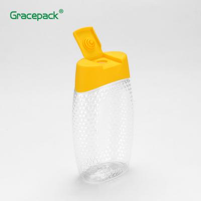 China Soft Empty ketchup sauce bottle with silicone flip top cap, PET plastic honey squeeze bottle for sale