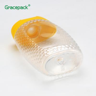 China food grade custom Soft Empty ketchup sauce bottle with silicone flip top cap  PET plastic 500g upside down honey squeeze bottle for sale