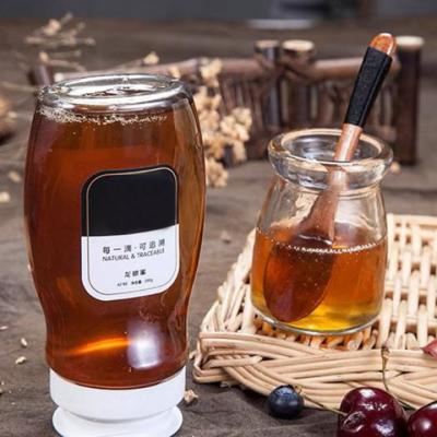 China Plastic Honey Squeezing Bottle With Screw Cap Trading Food Grade Pet Plastic Honey Squeeze Bottles Flip Top Lid for sale