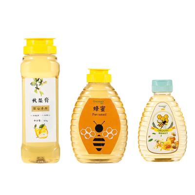 China New 2021 Plastic Pet Honey Squeeze Bottle Packing Bottles Food Grade Empty Clear Squeeze Jar for sale