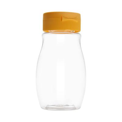 China Honey Bottle Squeeze Cup For Packing Honey Or Sauce Transparent Silicone Valve Design for sale