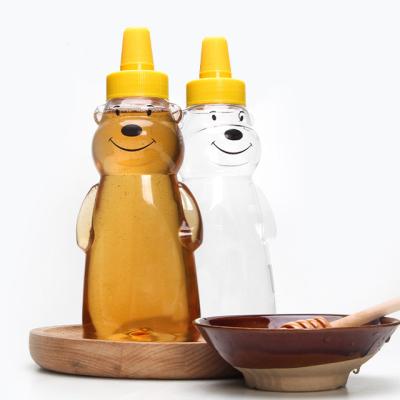 China PET Honey Bottle Unique Cartoon Bear Design Plastic Squeeze Bottle With Pointed Cap for sale