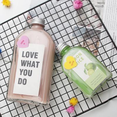 China Factory sells bottle packaging drink flat shape beverage bottles, glass juice bottle 100ml 200ml 350ml 500ml for sale