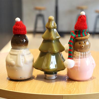 China Creative Cartoon Snowman Juice Bottle Pet Bottle With Lid Milk Tea Juice Plastic Disposable 400Ml Beverage Packaging for sale