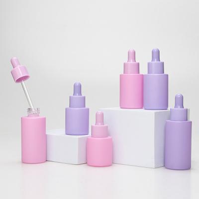 China 20ml 30ml high quality round shape custom pink color glass dropper cosmetic packaging container for essence essential oil for sale