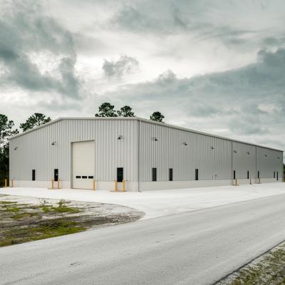 China Galvanized Industrial Prefab Metal Warehouses Steel Frame Construction Fully Customizable for sale