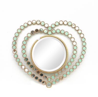 China Vintage antique heart shape  metal wall mirror for bedroom decoration in gold for sale