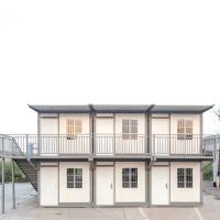 China Flat Pack Container House 50mm EPS Sandwich Panel Pre-Wired Electricity 4 Workers 3 Hours Installation for sale