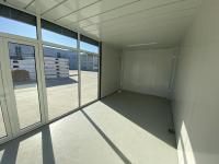 China Flat Pack Container House 50mm EPS Sandwich Panel Pre-Wired Electricity 4 Workers 3 Hours Installation for sale