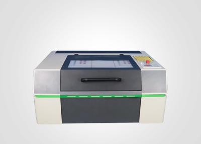 中国 アクリルの広告の小さい二酸化炭素レーザーの彫版機械水冷のタイプ 販売のため