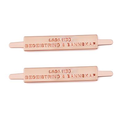 China Customized Engraved Logo In Metal Color Gold Rose Bag Label Ecofriendly Hardware Te koop