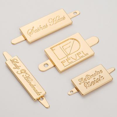 中国 Handbags Metal Bag Label Personalized Engraved Metal Embossed Logo 販売のため