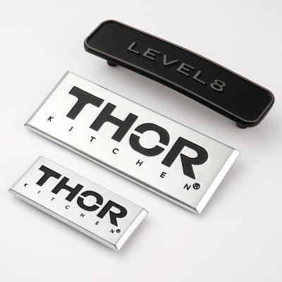China Fashion Die Casting Metal Tag For Furniture Embossed Logo Customized Metal Label Te koop