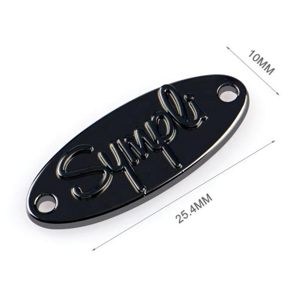 Quality Plating Metal Clothing Label Custom 2 Holes Metal Label for Garment Sewn Oval for sale