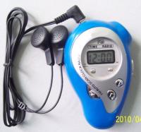 China Mango Shape FM Radio with LCD Time Display 25mm AAA Battery Powered Clock for sale