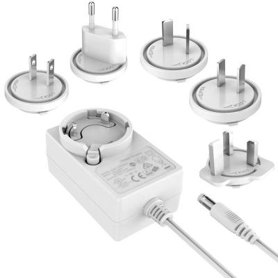 Cina 100%PC Adaptore internazionale con presa intercambiabile 30W 36W AU US EU UK Stock 5V 9V 12V 24V 1.75A 3A Adaptore di viaggio DC in vendita