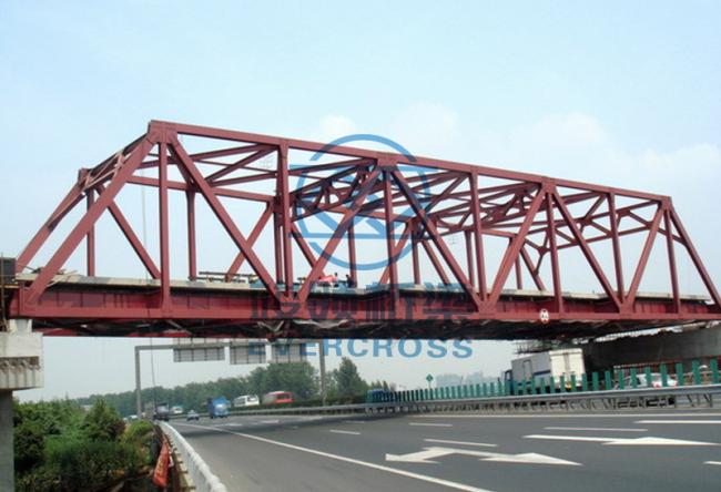 Completed steel truss bridge installation showing full span