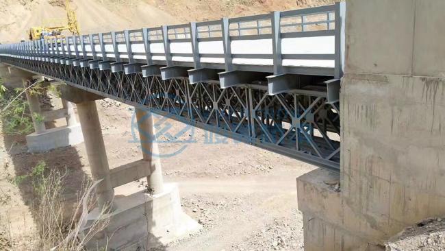Bailey Trestle Bridge in operational environment with vehicles crossing