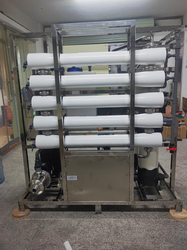 Commercial automatic desalination device exterior view showing stainless steel construction and control panel