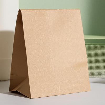 China Production Time 12-15 Days Kraft Paper Bag with Custom Pattern and Art Coated Paper Offering Durable Packaging Solutions for sale