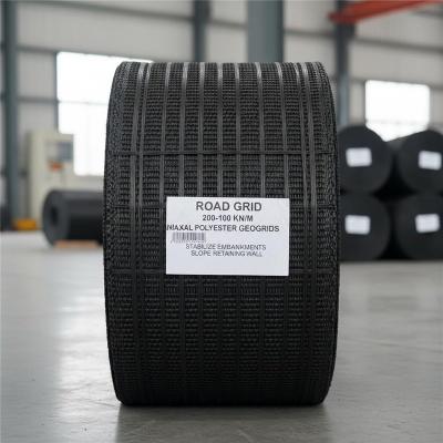 China Road Grid 200-100 KN/M Uniaxial Polyester Geogrids Stabilize Embankments Slope Retaining Wall for sale
