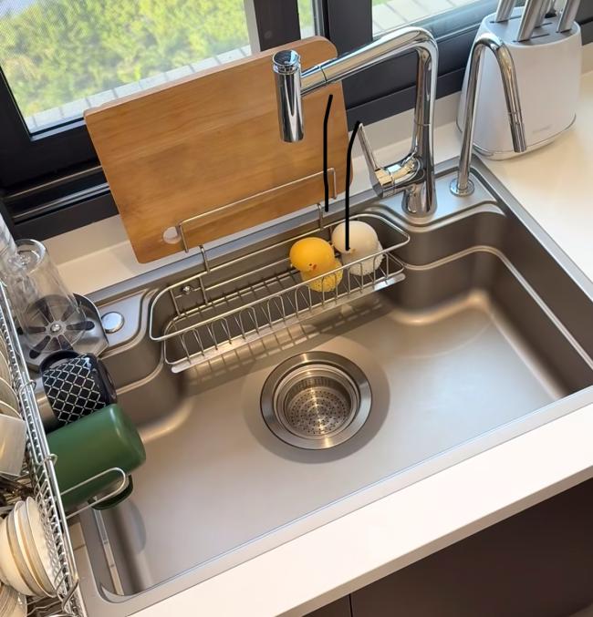 Happy user with kitchen sink partition in modern kitchen