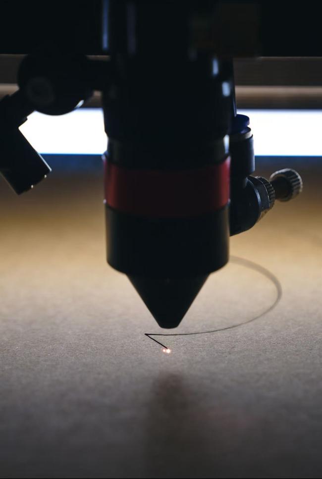 Laser cutting system processing metal components