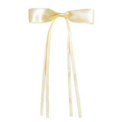 Cina Belle ragazze capelli arco fatto a mano nastro giallo satinato con oro arco nastro stile arco in vendita